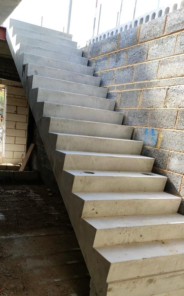 Crane lifting precast concrete planks and stairs in Titchfield, Fareham ...