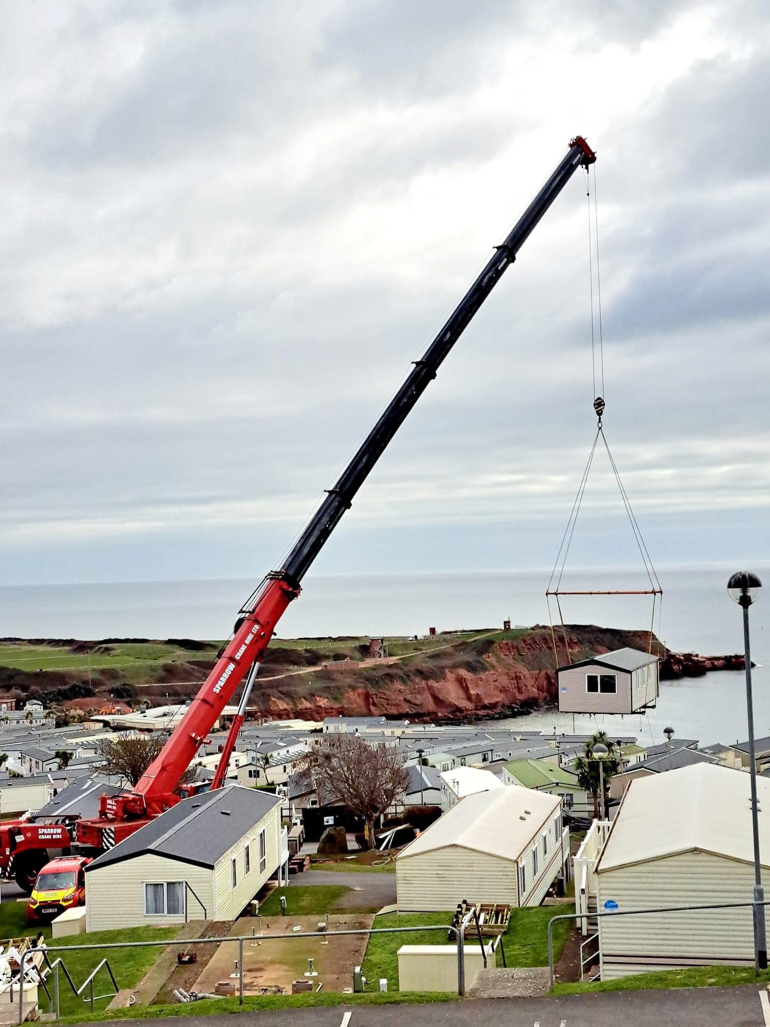 Grove GMK5250L relocating lodges at Devon Cliffs, Exmouth | Sparrow ...